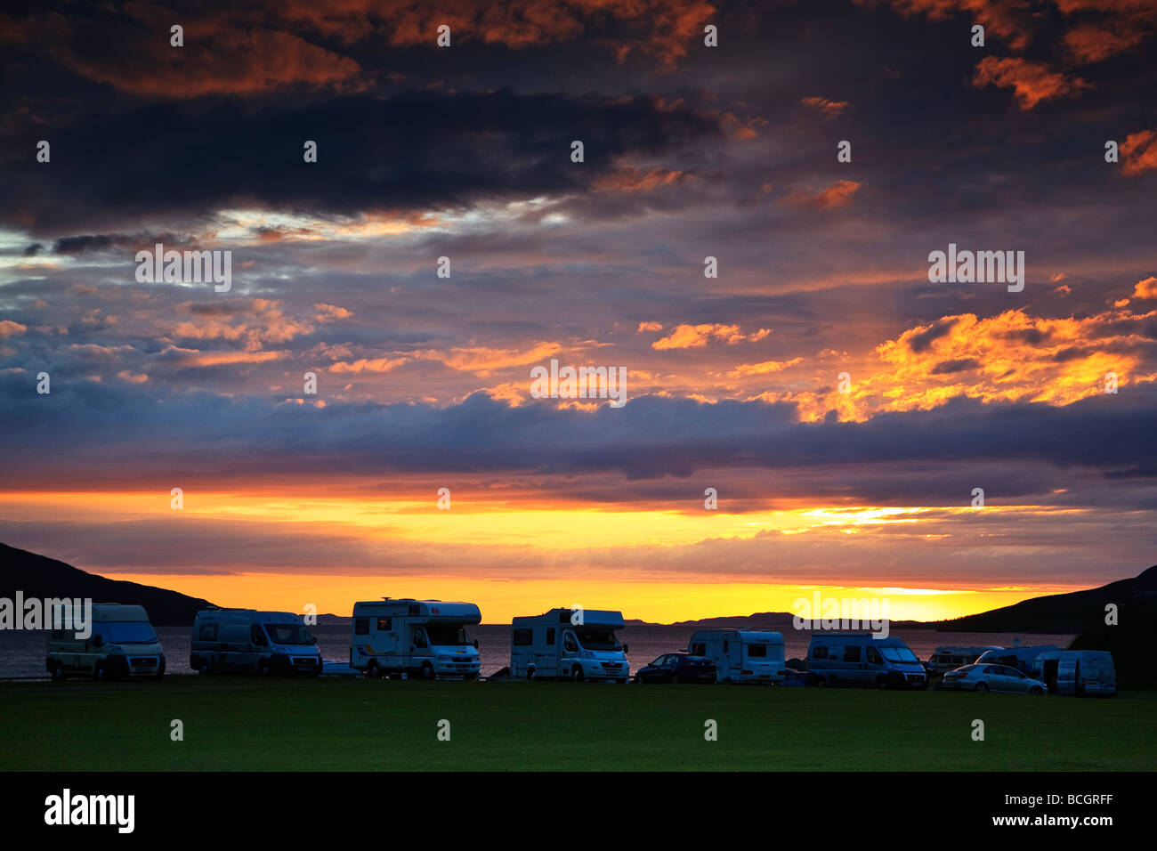 Camper vans on a campsite at sunset, Ullapool, Loch Broom, Highlands ...