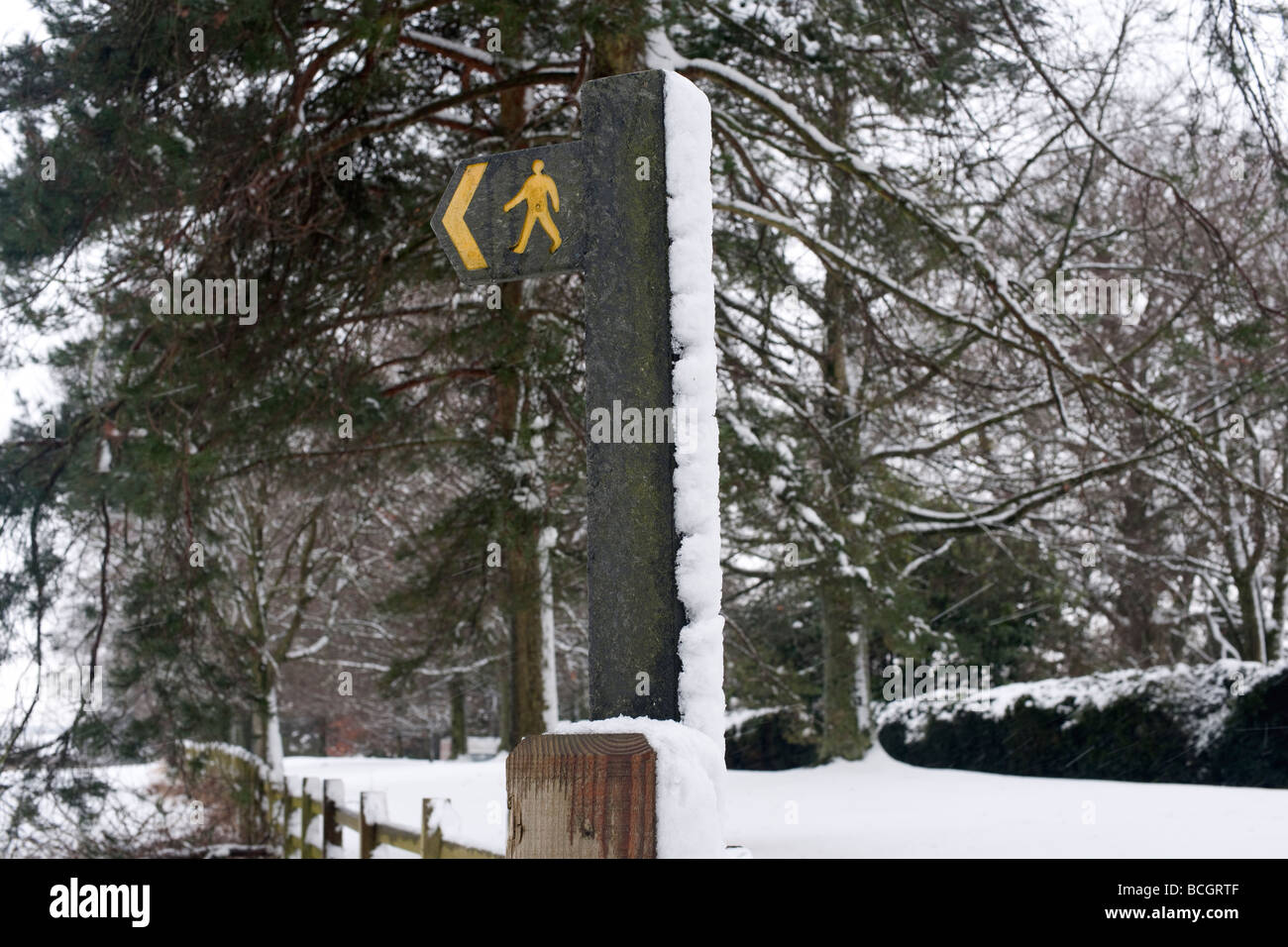walking route sign post in winter snow Stock Photo - Alamy