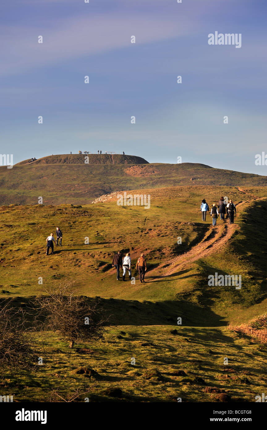 WALKERS ON BRITISH CAMP AN IRON AGE HILL FORT ON THE MALVERN HILLS ON ...