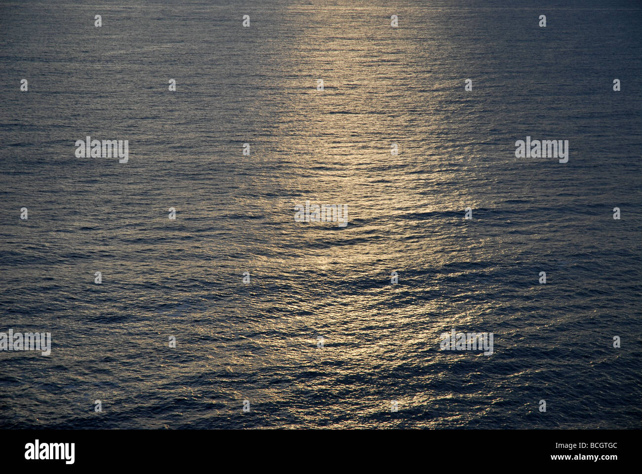 sunlight reflecting on the sea at dawn Stock Photo - Alamy