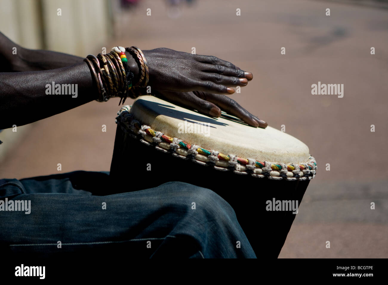 Close up view of a tribal drum being played Stock Photo - Alamy