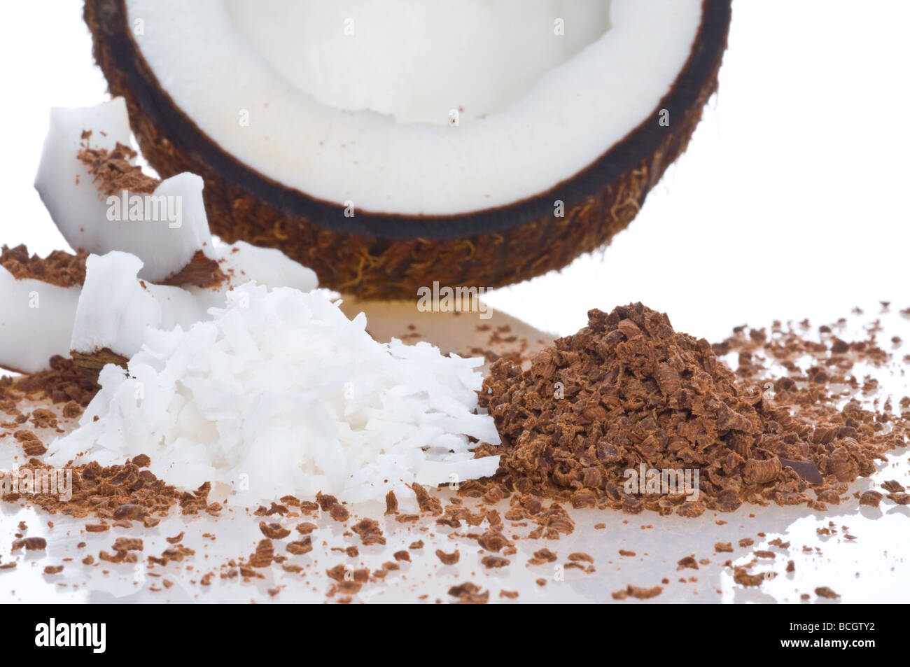 Cracked coconut on white isolated Stock Photo - Alamy