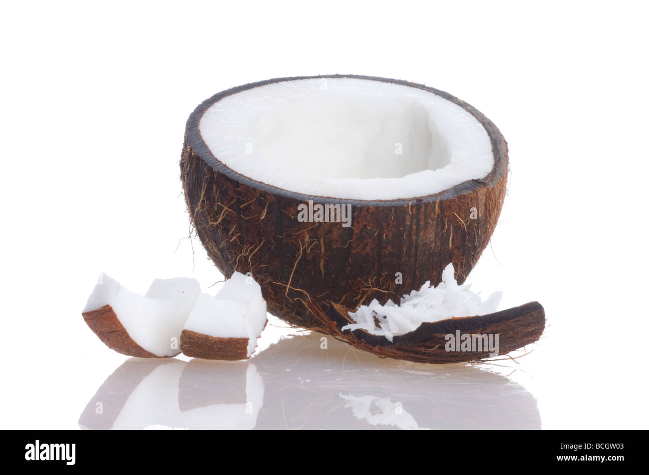 Cracked coconut on white isolated Stock Photo - Alamy