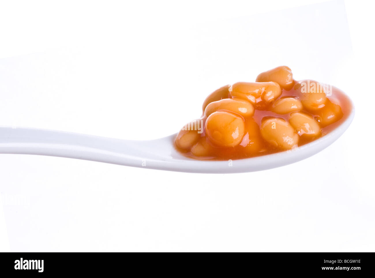 Tinned String bean in tomato sauce in a spoon isoalted Stock Photo - Alamy