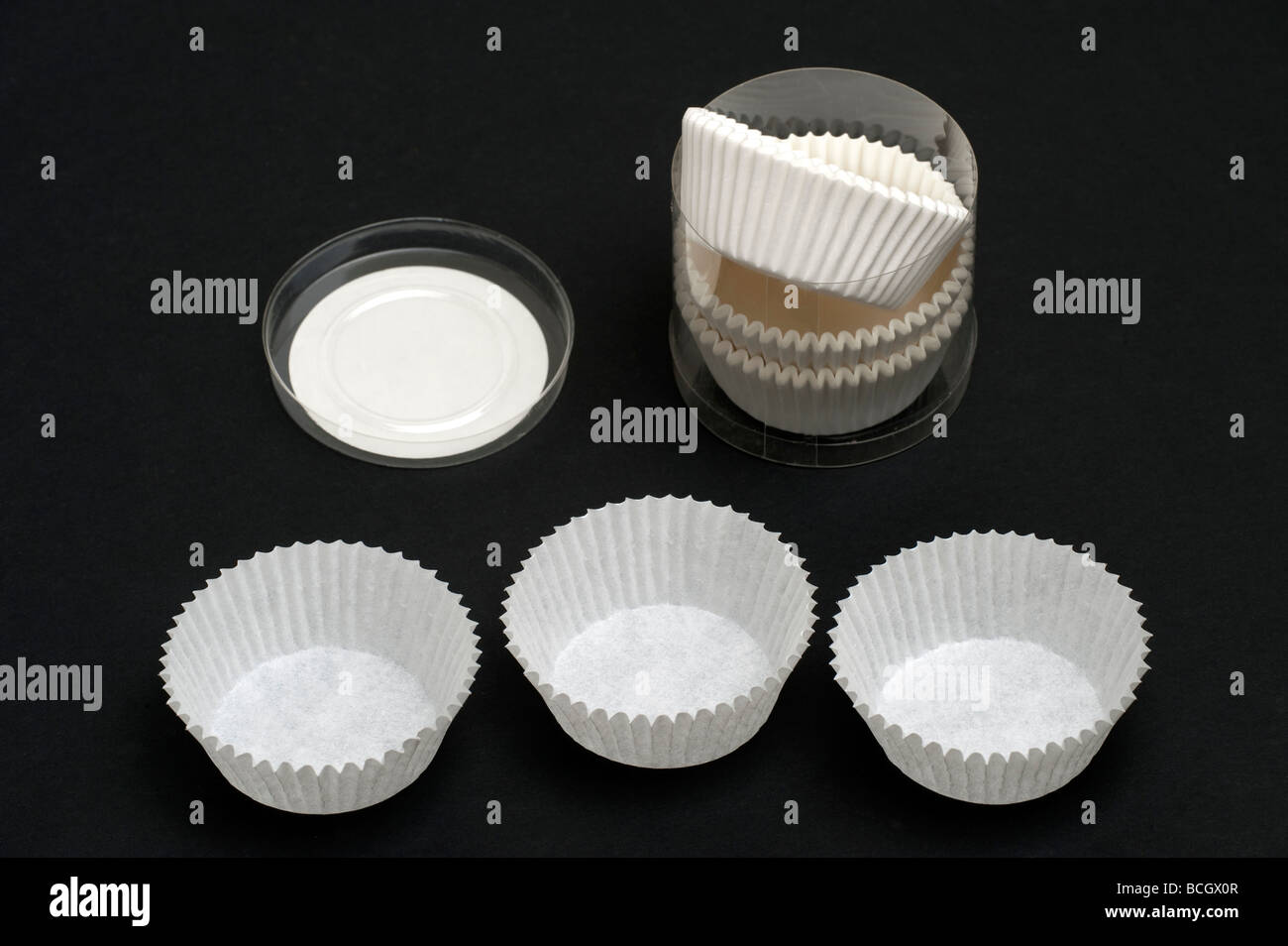 white paper bun cases and plastic holder Stock Photo - Alamy