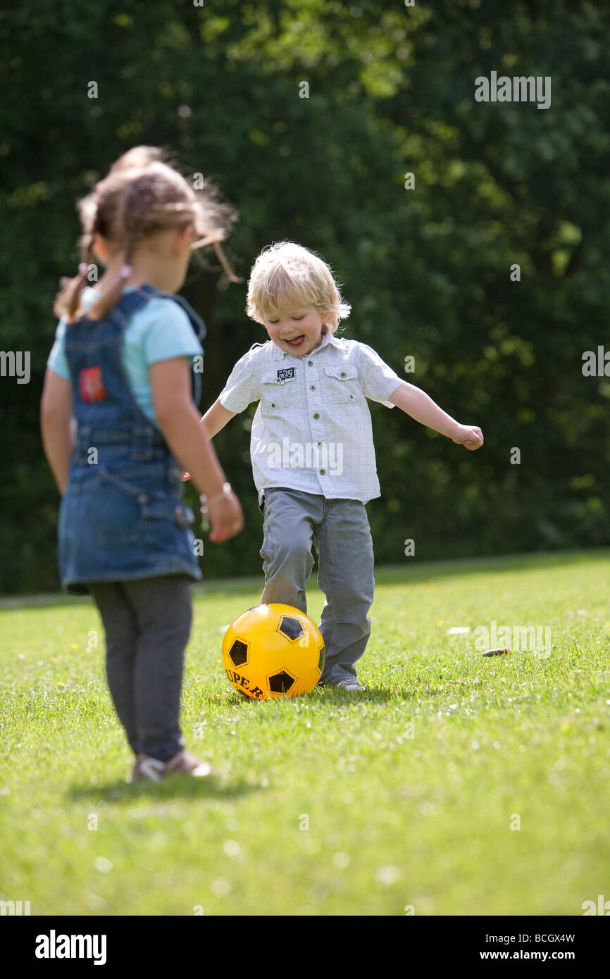 Boy girl kick play hi-res stock photography and images - Alamy