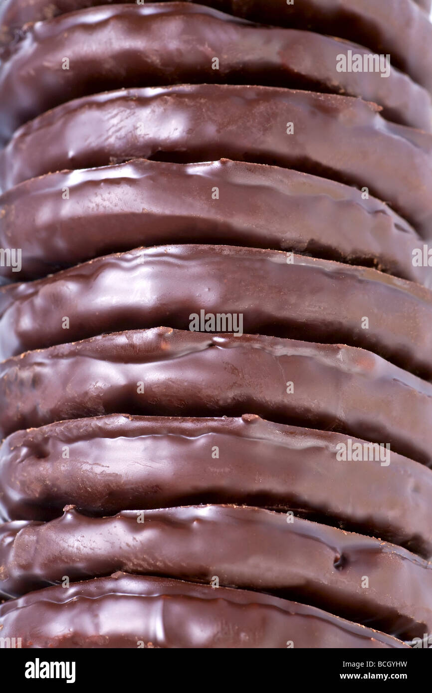 appetizing biscuit in dark chocolate food background Stock Photo - Alamy