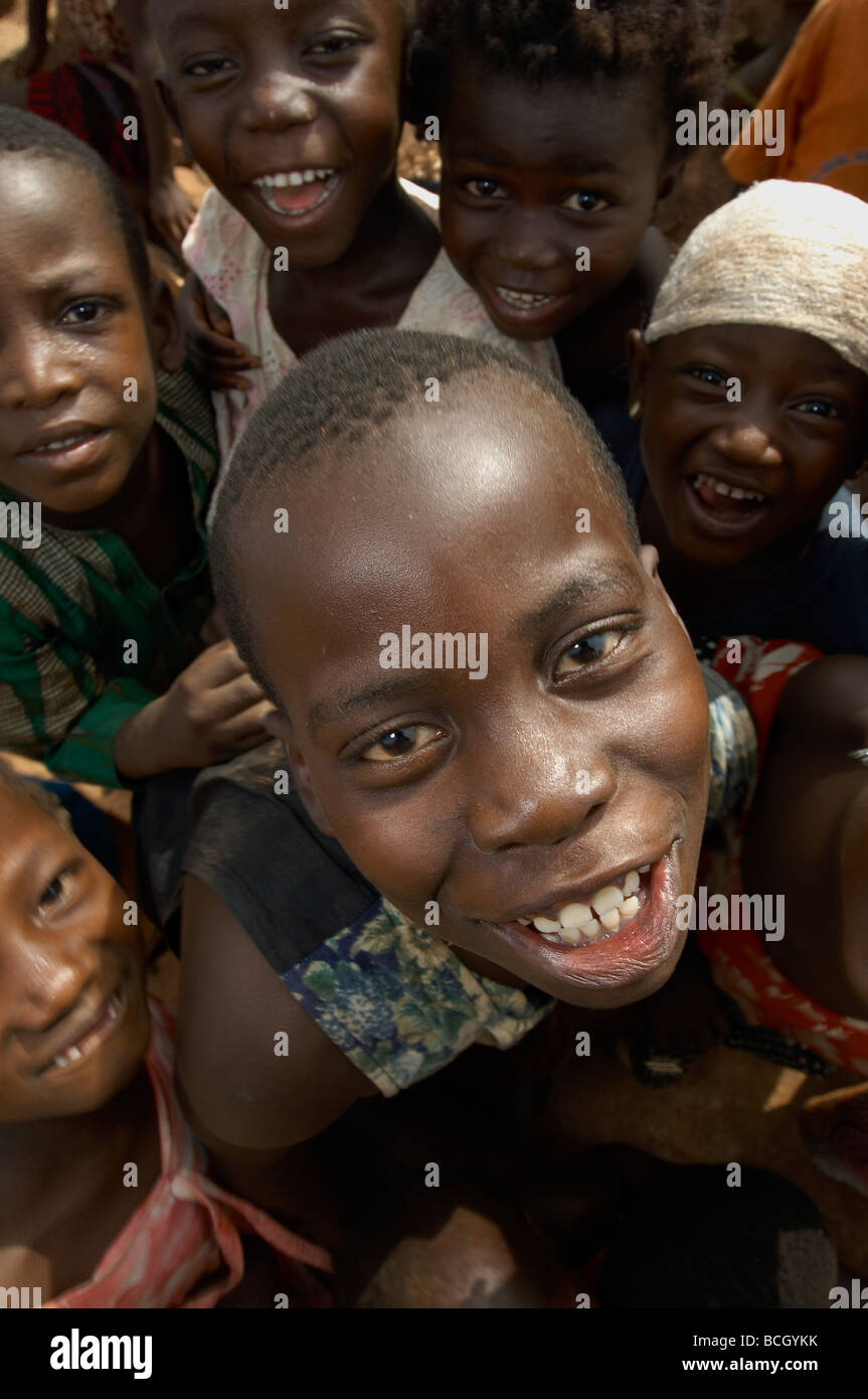 African boy looking at camera surrounded by other children Stock Photo ...