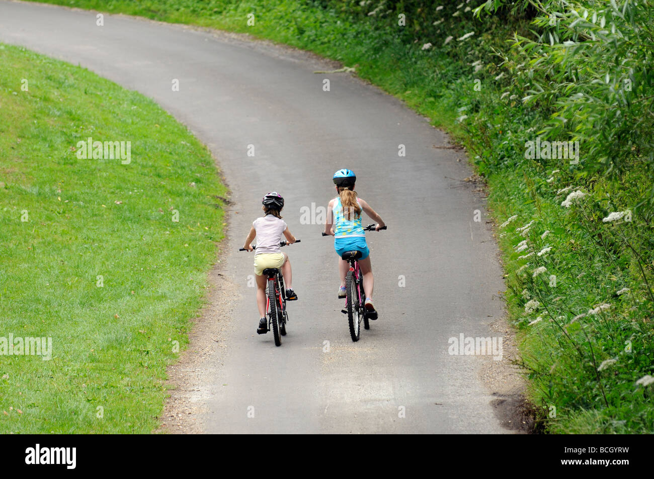 Children cycling along a country lane England UK Stock Photo - Alamy