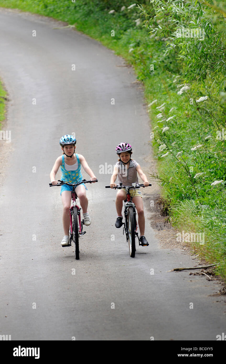 Children cycling along a country lane England UK Stock Photo - Alamy