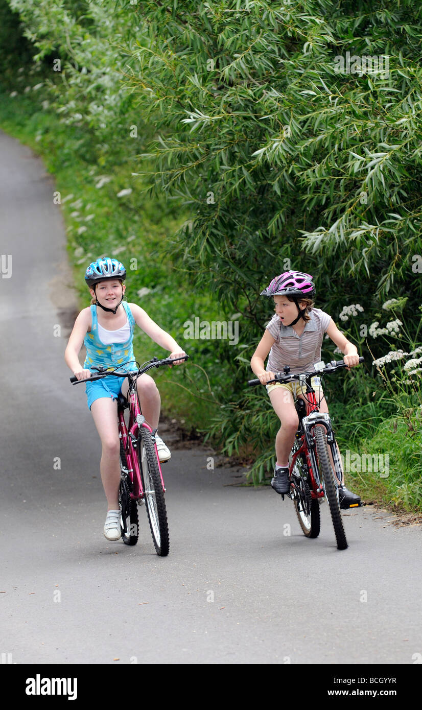 Children cycling along a country lane England UK Stock Photo - Alamy