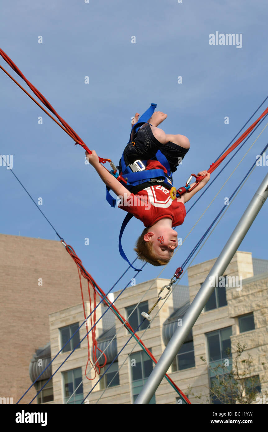 Boy enjoying European bungee Stock Photo - Alamy