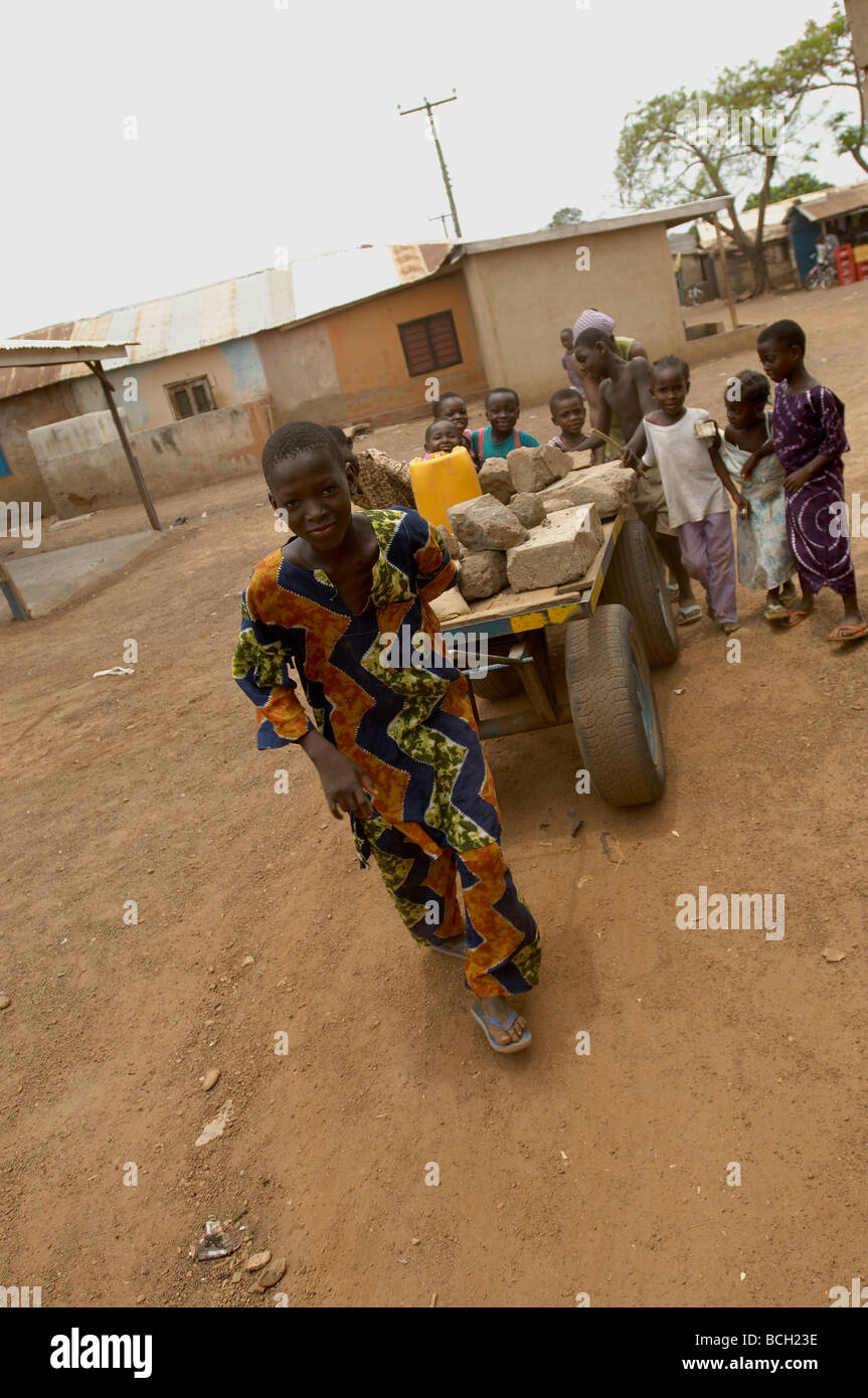 Children pulling heavy cart in Tamale Ghana Stock Photo - Alamy