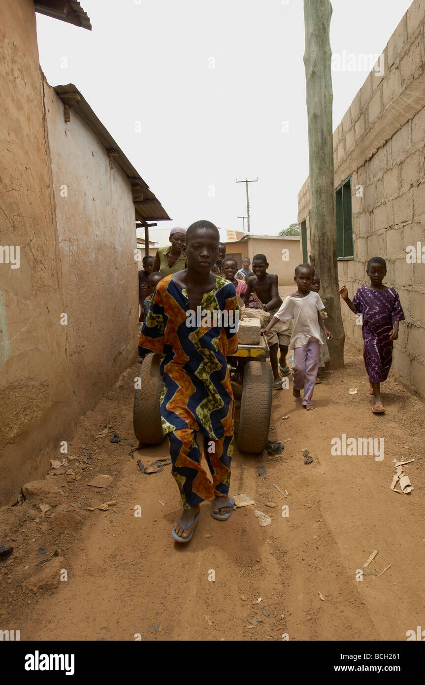 Children pulling heavy cart in Tamale Ghana Stock Photo - Alamy