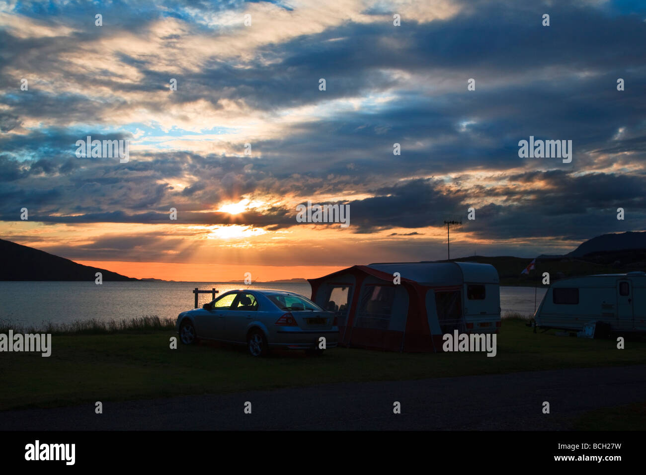 Camper vans on a campsite at sunset, Ullapool, Loch Broom, Highlands ...