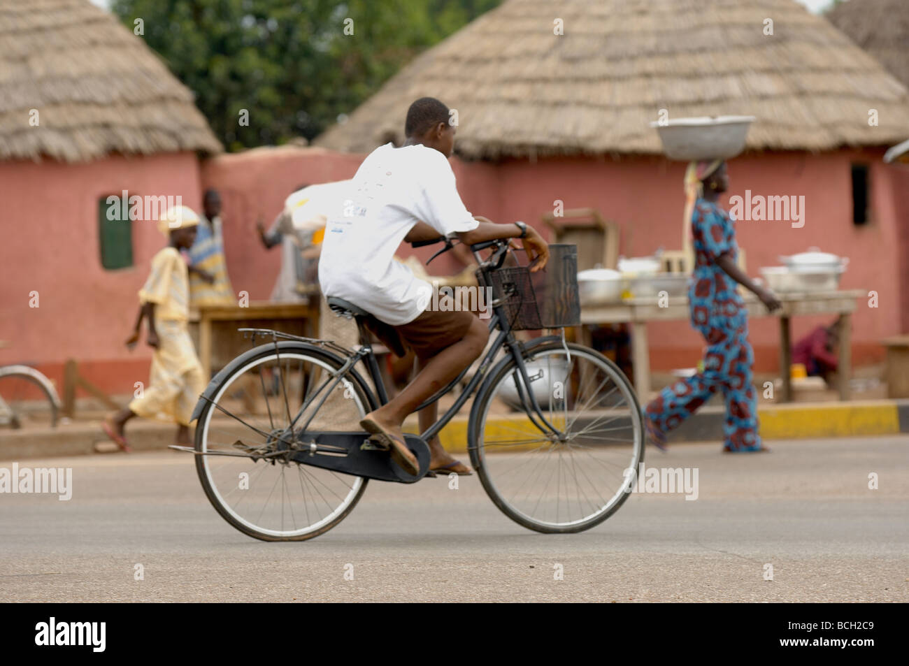 Boy on bike in Tamale Ghana Stock Photo - Alamy