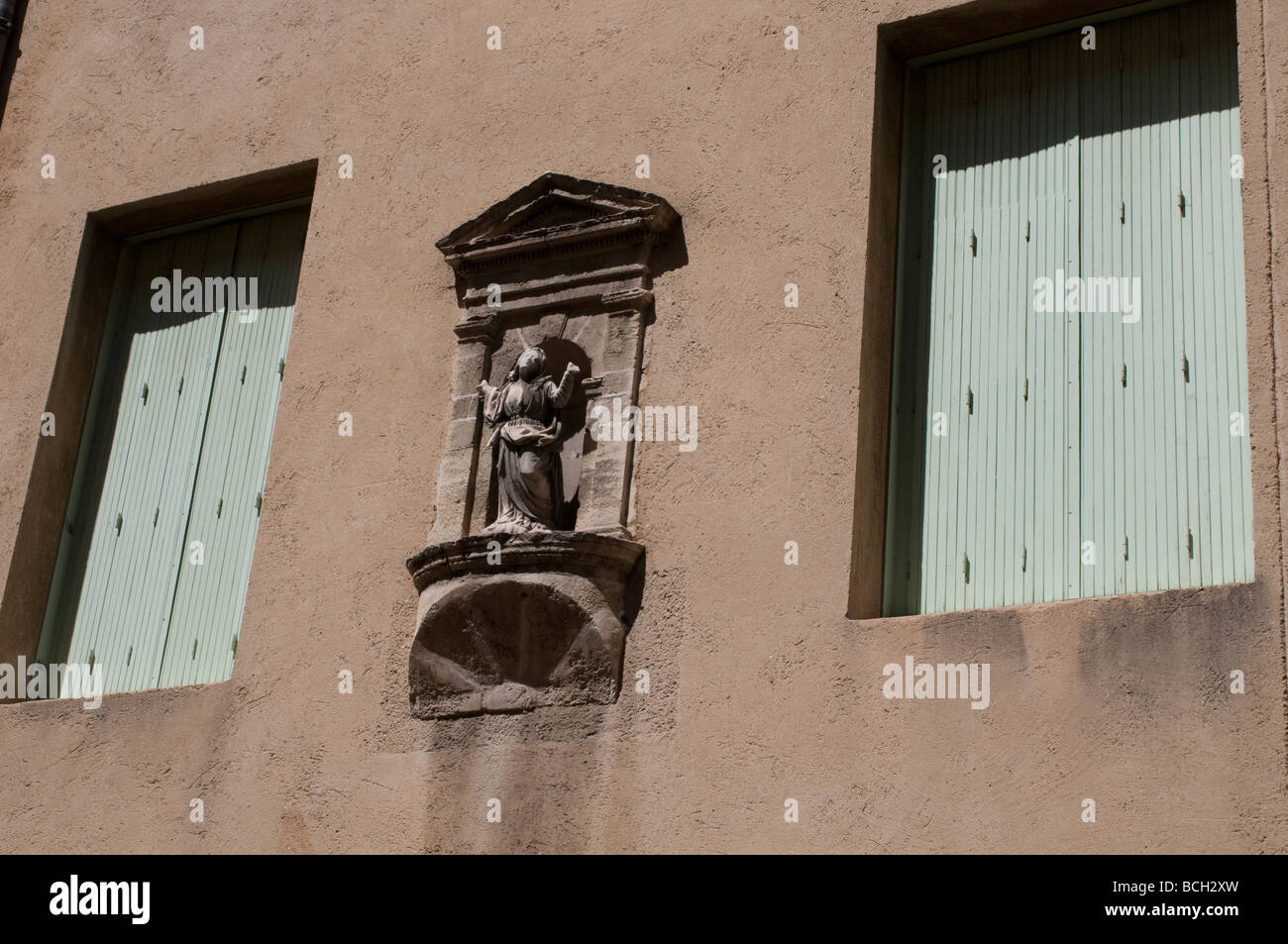 Small religious statue on a house Avignon France Stock Photo - Alamy