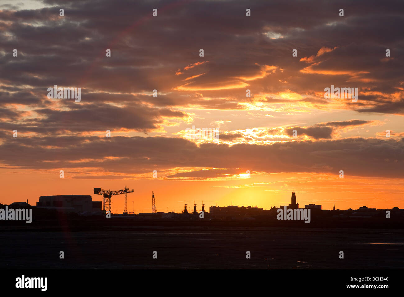 Sunset over Barrow in Furness town and shipyard Cumbria UK Stock Photo ...