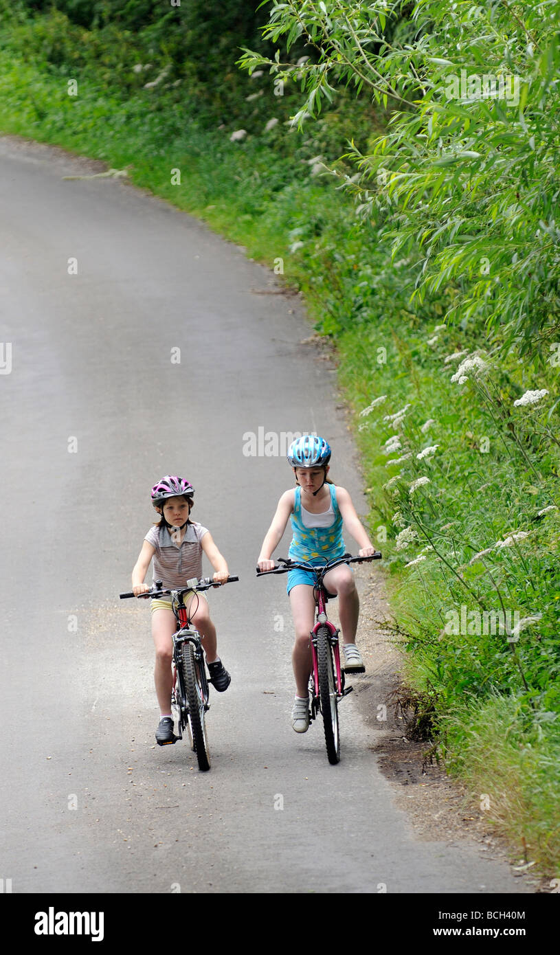 Children cycling along a country lane England UK Stock Photo - Alamy