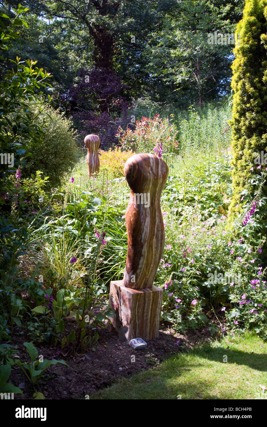 Statues in a country garden Stock Photo - Alamy