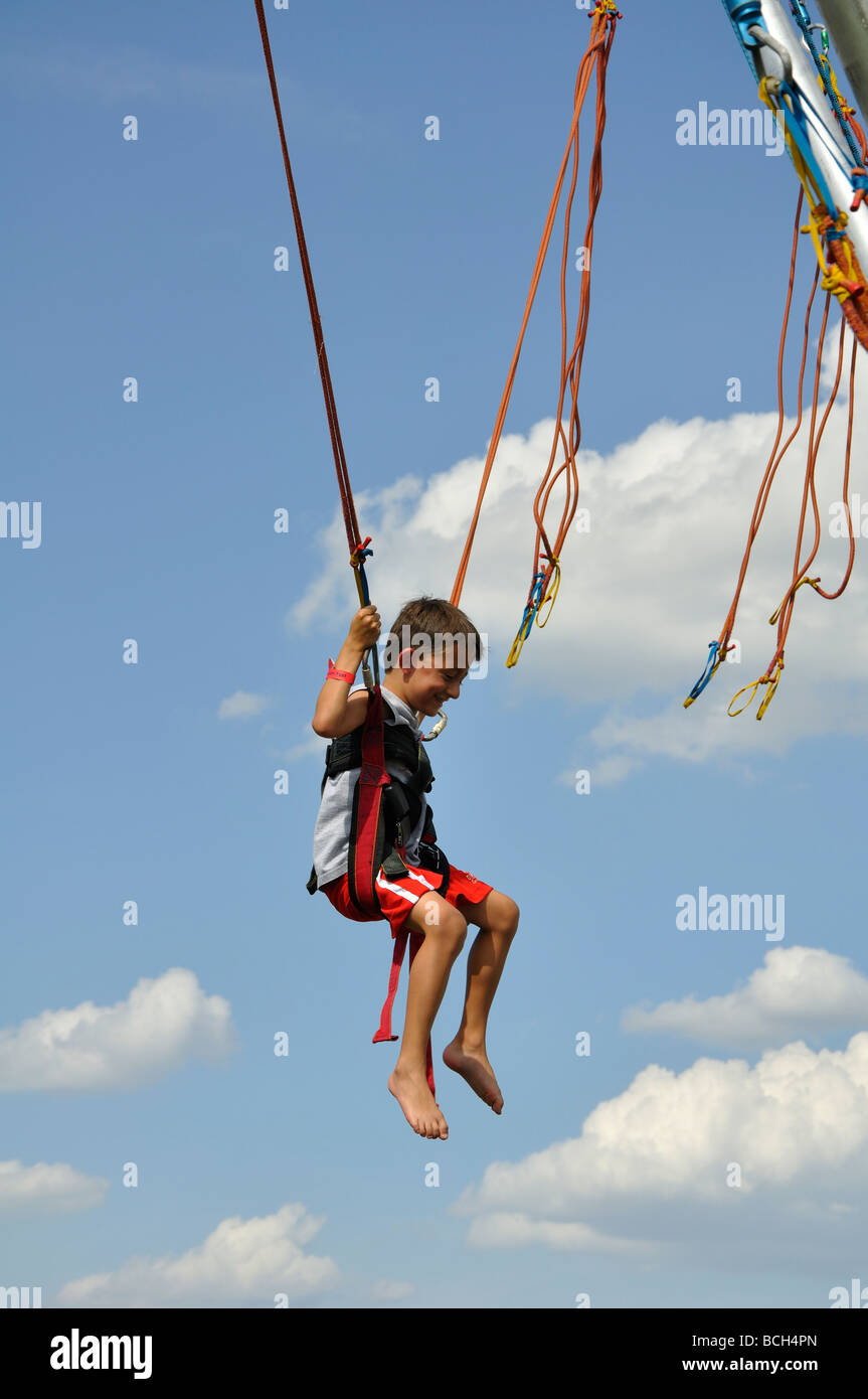 Boy enjoying European bungee Stock Photo - Alamy