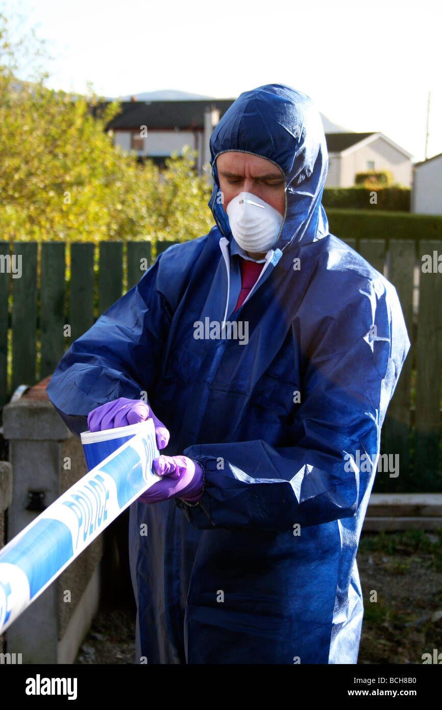 A police forensic officer tapes off a crime scene Stock Photo - Alamy