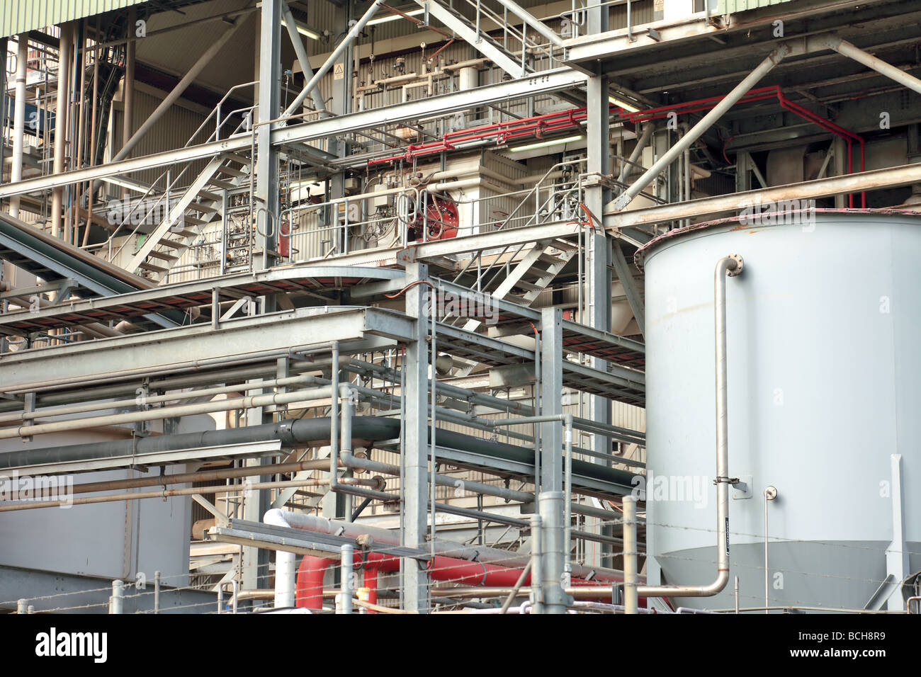 Industrial detail of a sugar cane refinery showing process work of the ...