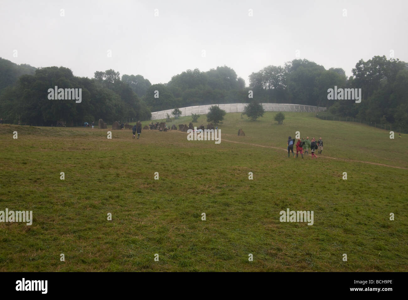 Stone circle in the rain at Glastonbury Festival 2009 Somerset England ...