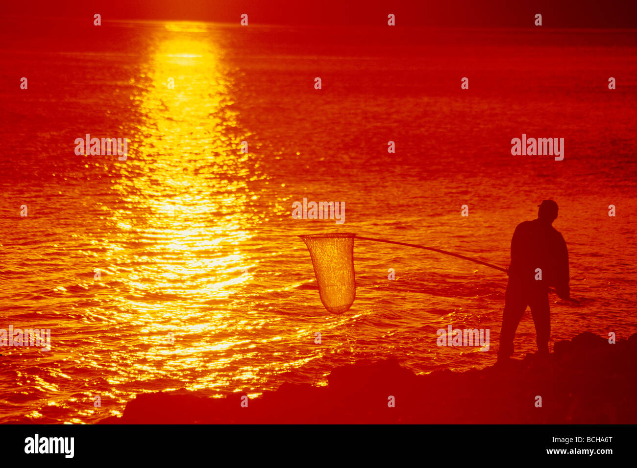 Man Hooligan Fishing Sunset Turnagain Arm SC Alaska Stock Photo - Alamy