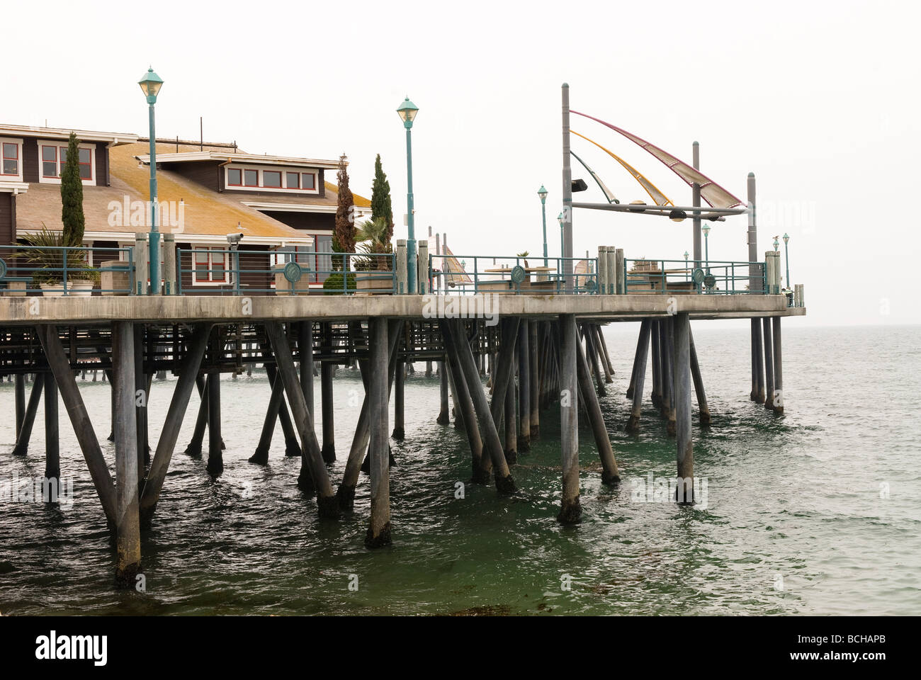A restaurant on the end of a pier during an overcast cold day Stock ...