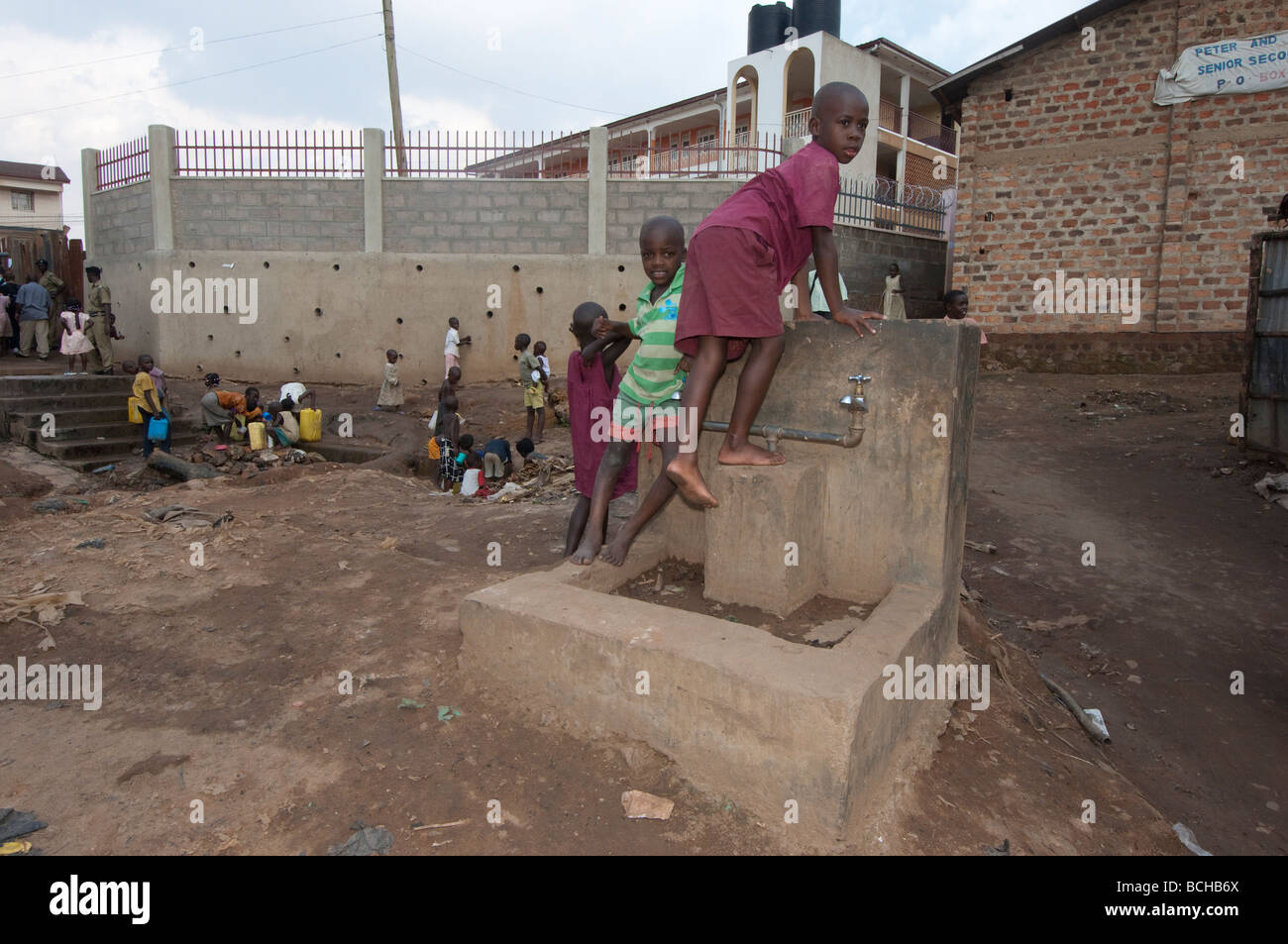 Children playing on private and unused clean water source in African ...