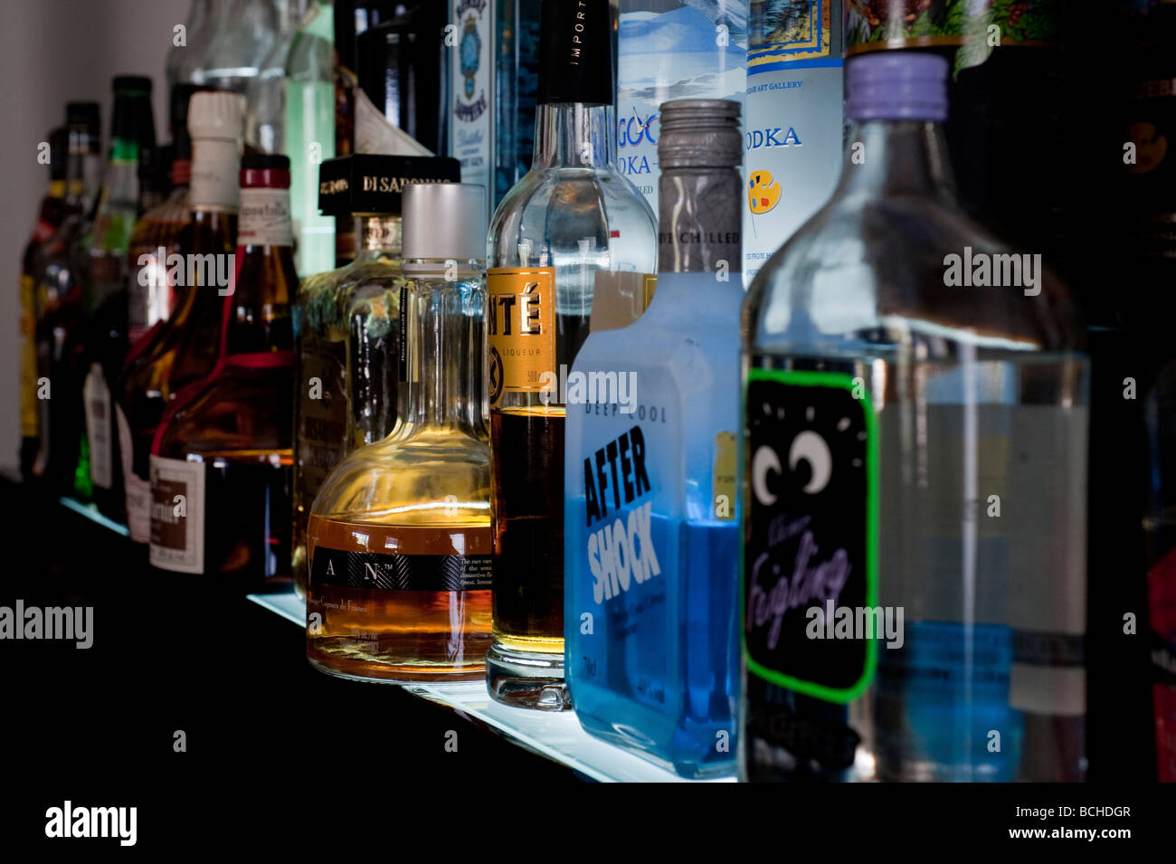Alcohol bottles on a shelf in a bar Stock Photo - Alamy