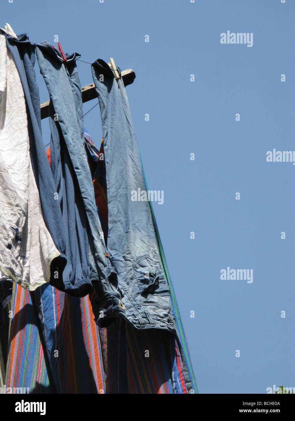 clothes on washing line outdoors in sun Stock Photo - Alamy