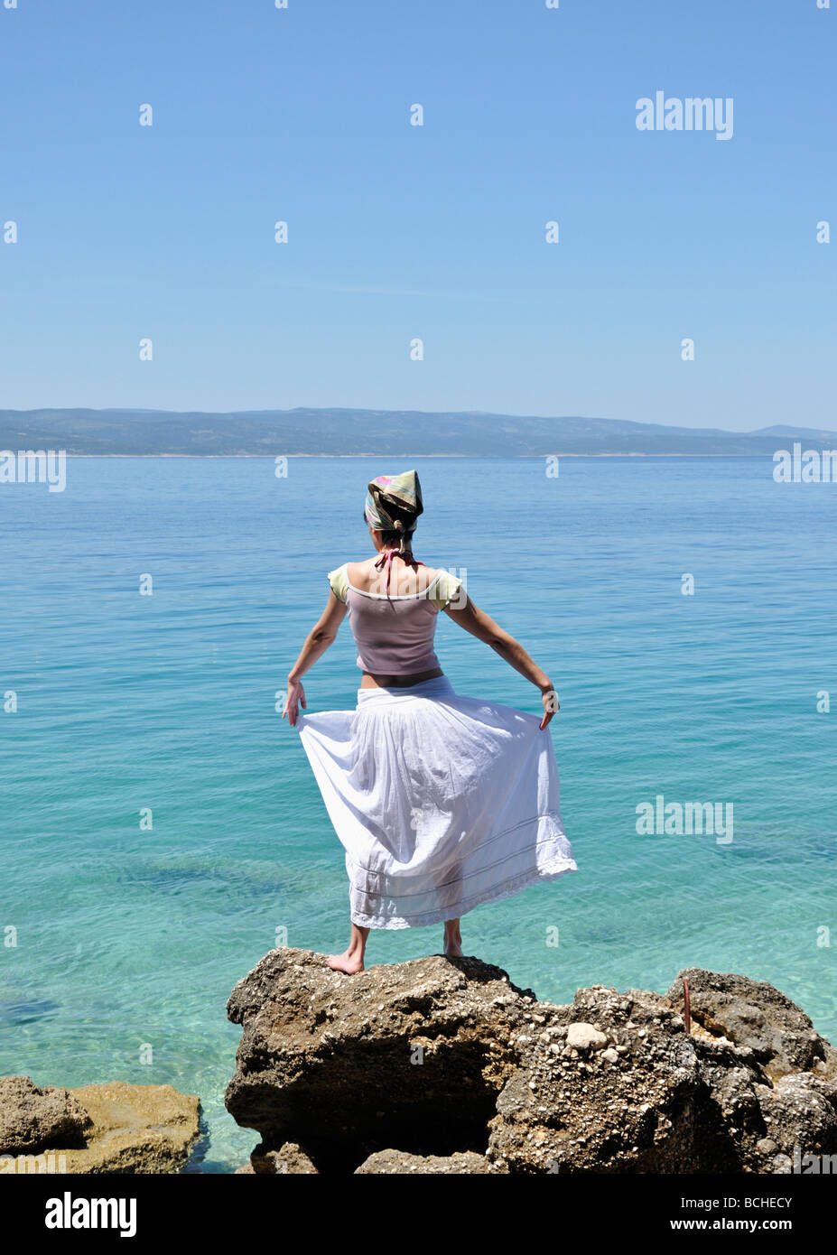 Woman at the rocks hi-res stock photography and images - Alamy