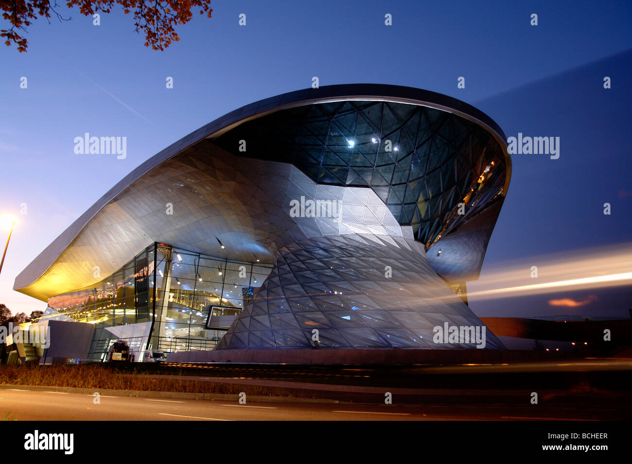 Futuristic architecture of the new BMW world at dusk Munich Germany ...