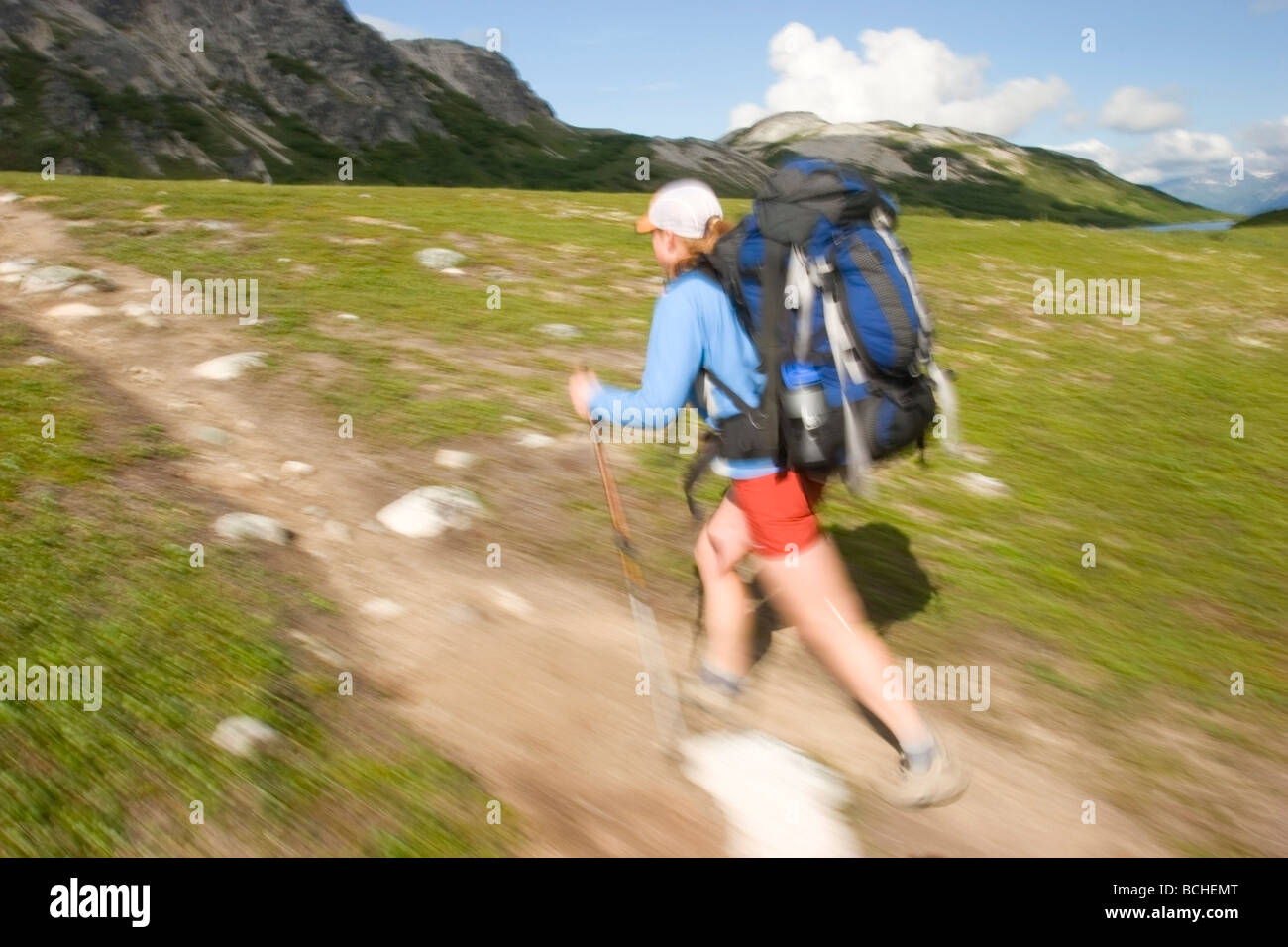 Female backpacker hiking on the Kesugi Ridge Trail Denali State Park ...