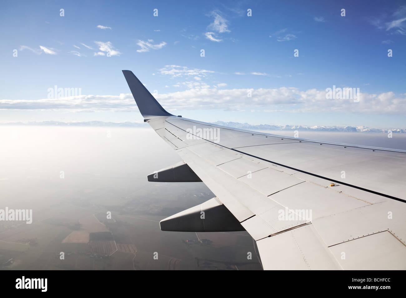 Wing from a passenger aircraft at the start Stock Photo - Alamy