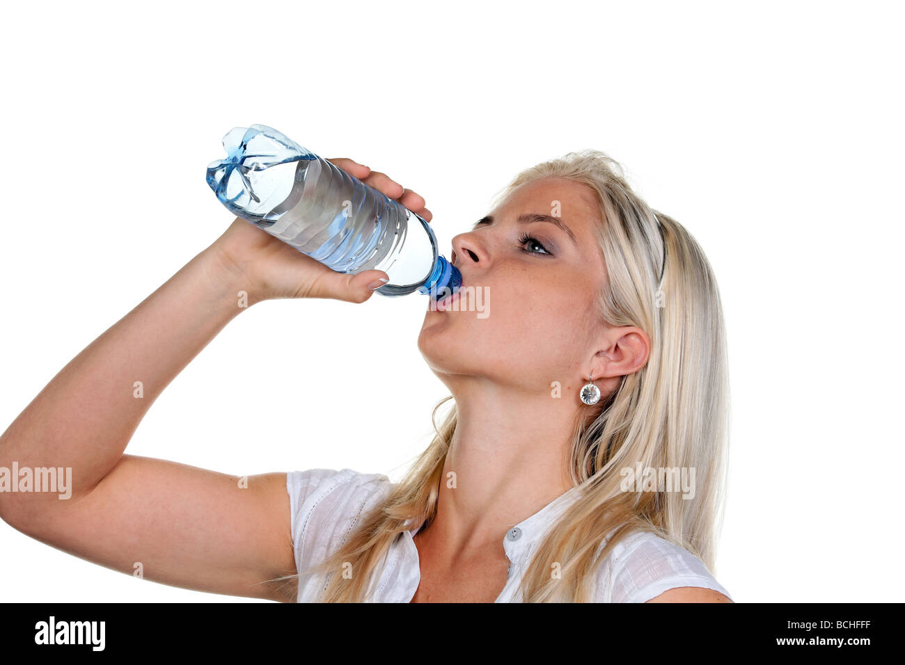 thirsty woman drinking mineral water from plastic bottle Stock Photo ...