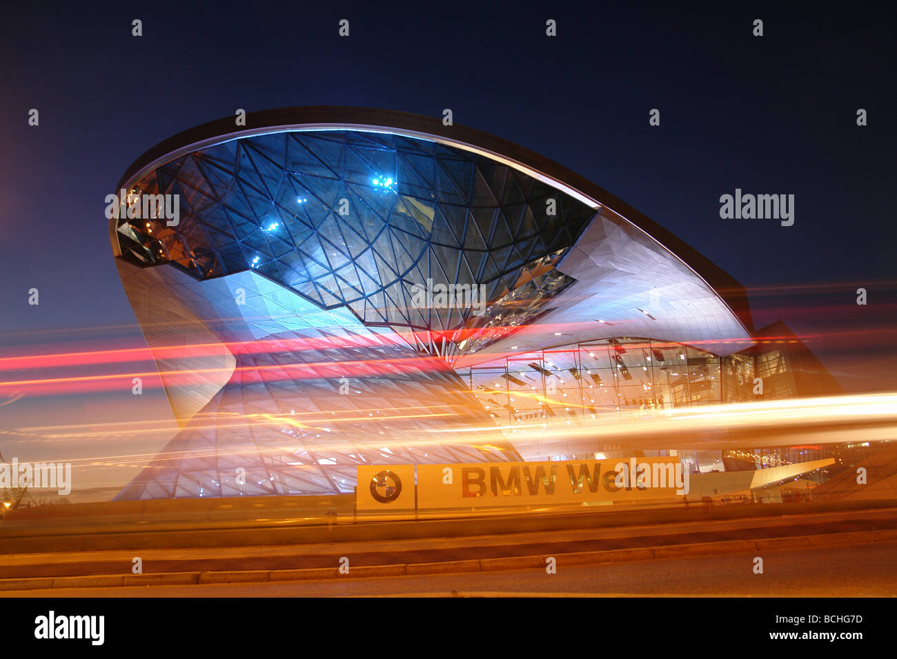 Futuristic architecture of the new BMW world at dusk Munich Germany ...