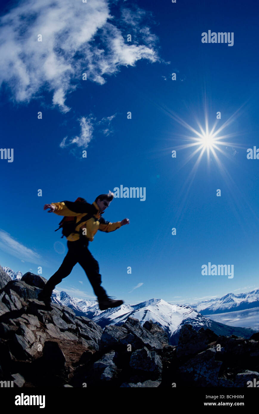 Man jumping between rocks hi-res stock photography and images - Alamy