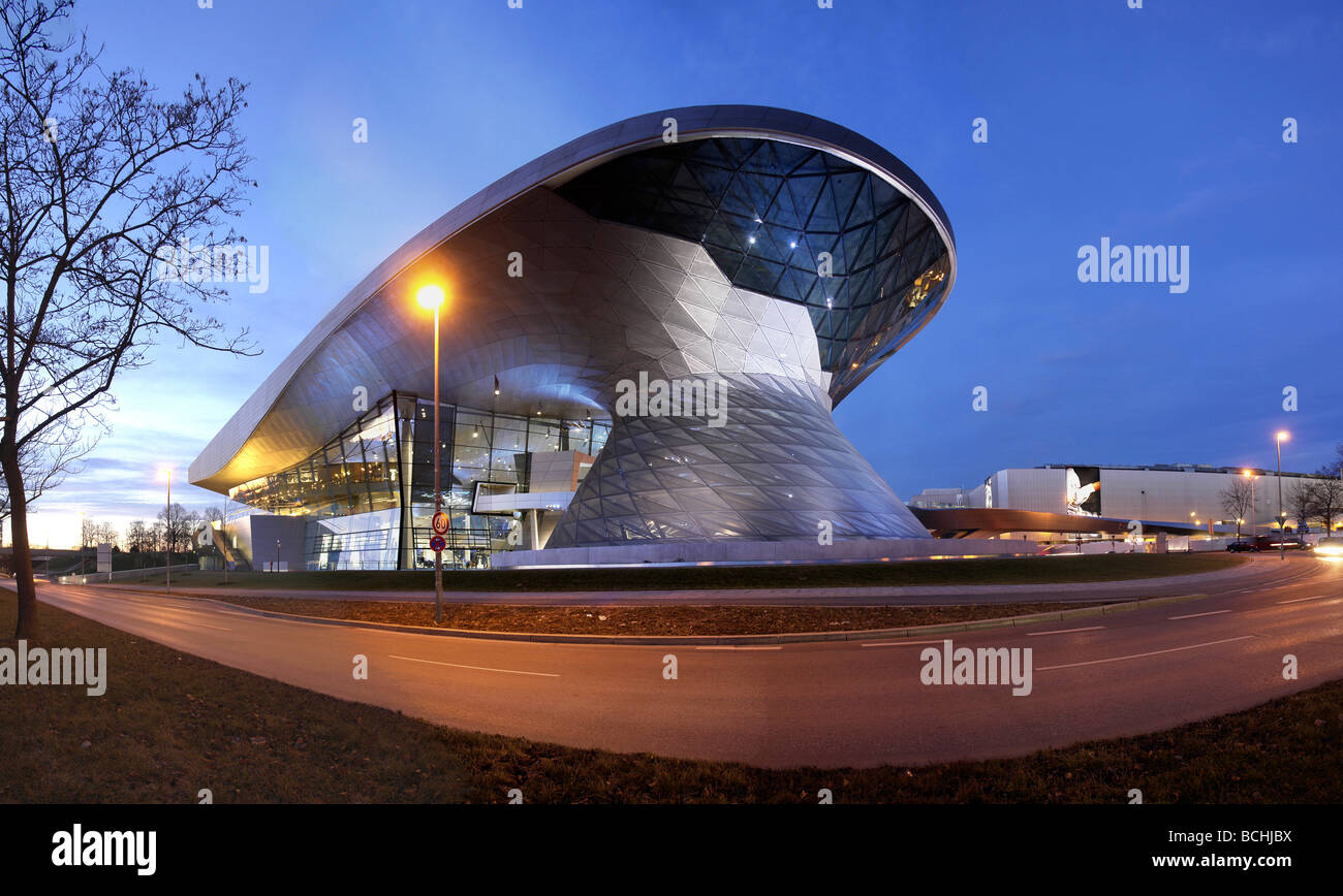 Futuristic architecture of the new BMW world at dusk Munich Germany ...