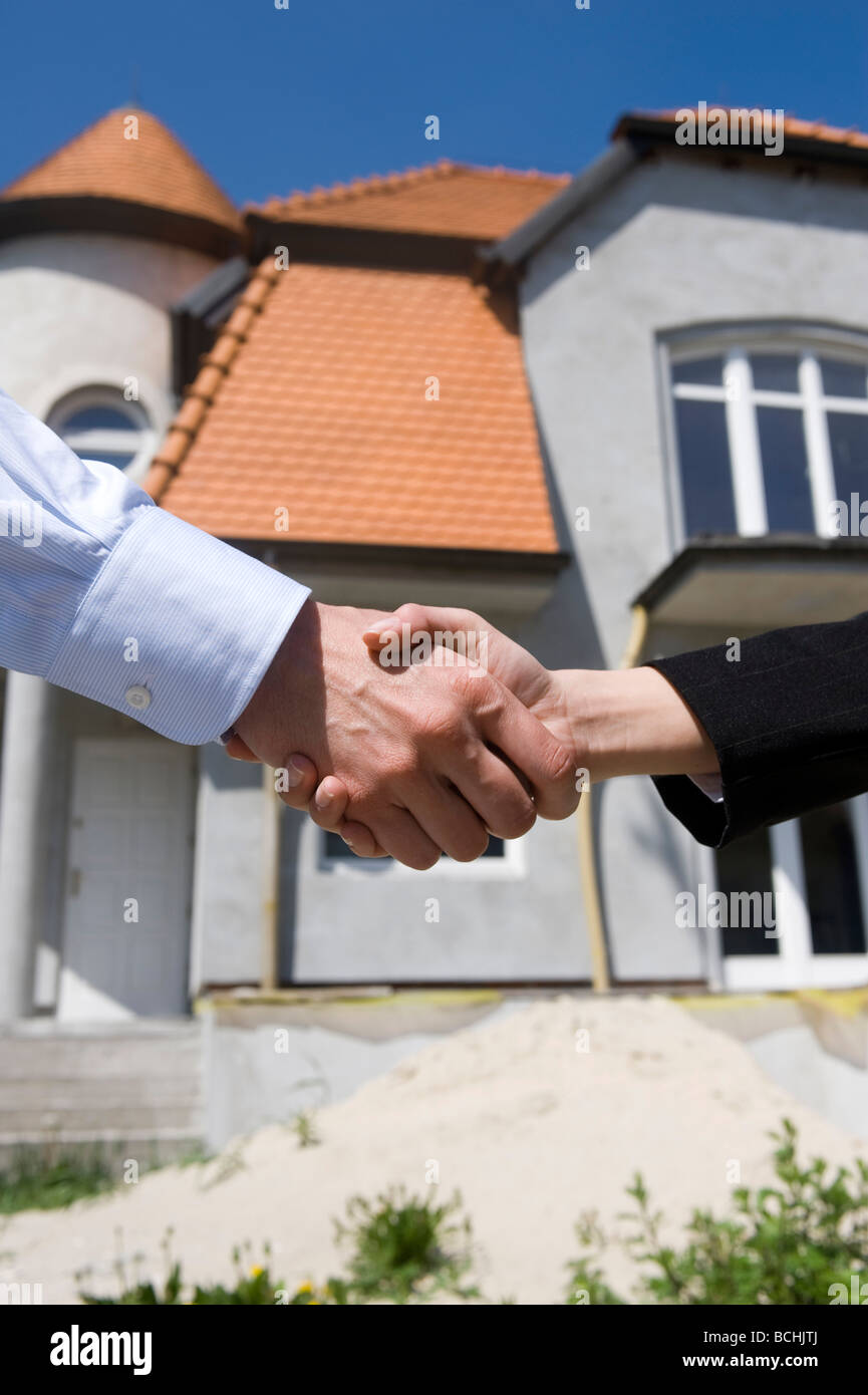 Man and woman shaking hands Stock Photo - Alamy