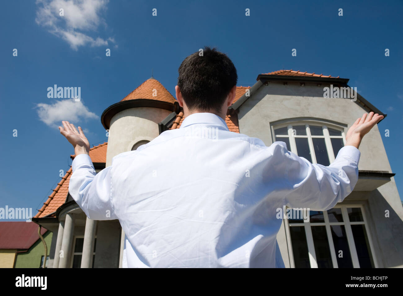 Man outside new house Stock Photo - Alamy