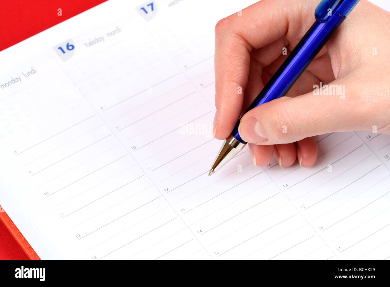 Close-up of woman hand writing in agenda Stock Photo - Alamy