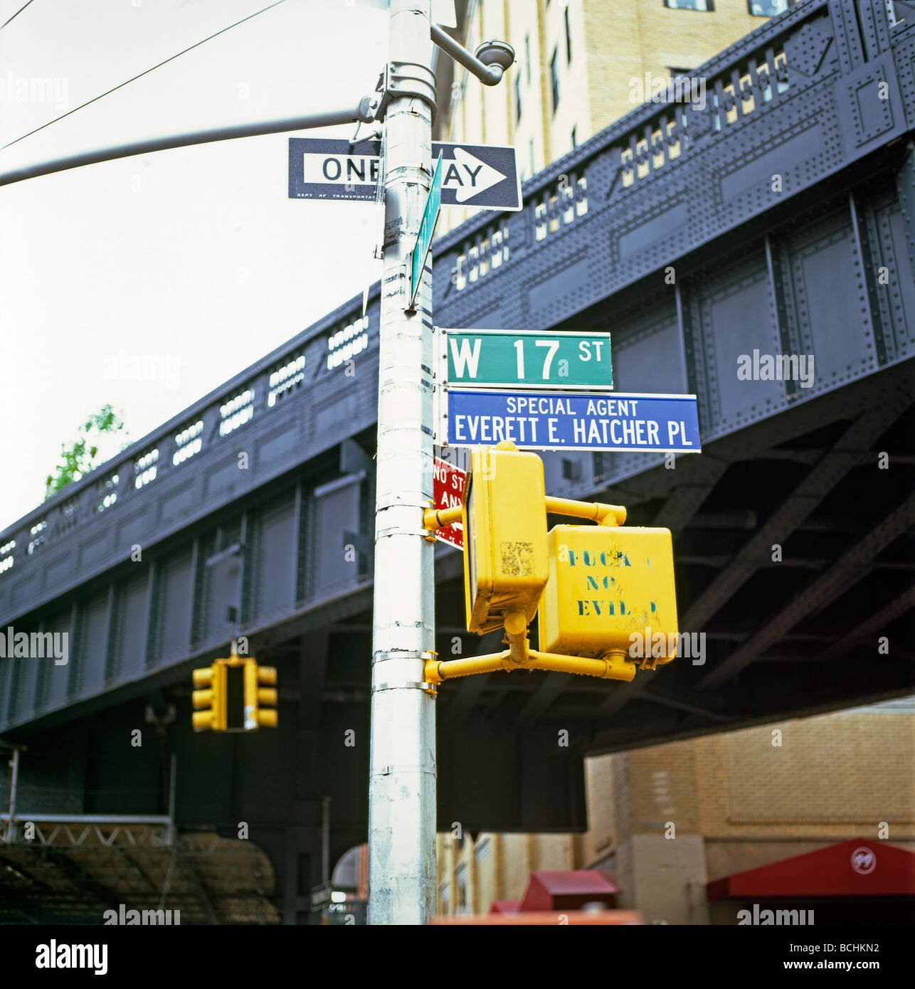 Special Agent Everett E. Hatcher Place and W 17th St street signs near ...