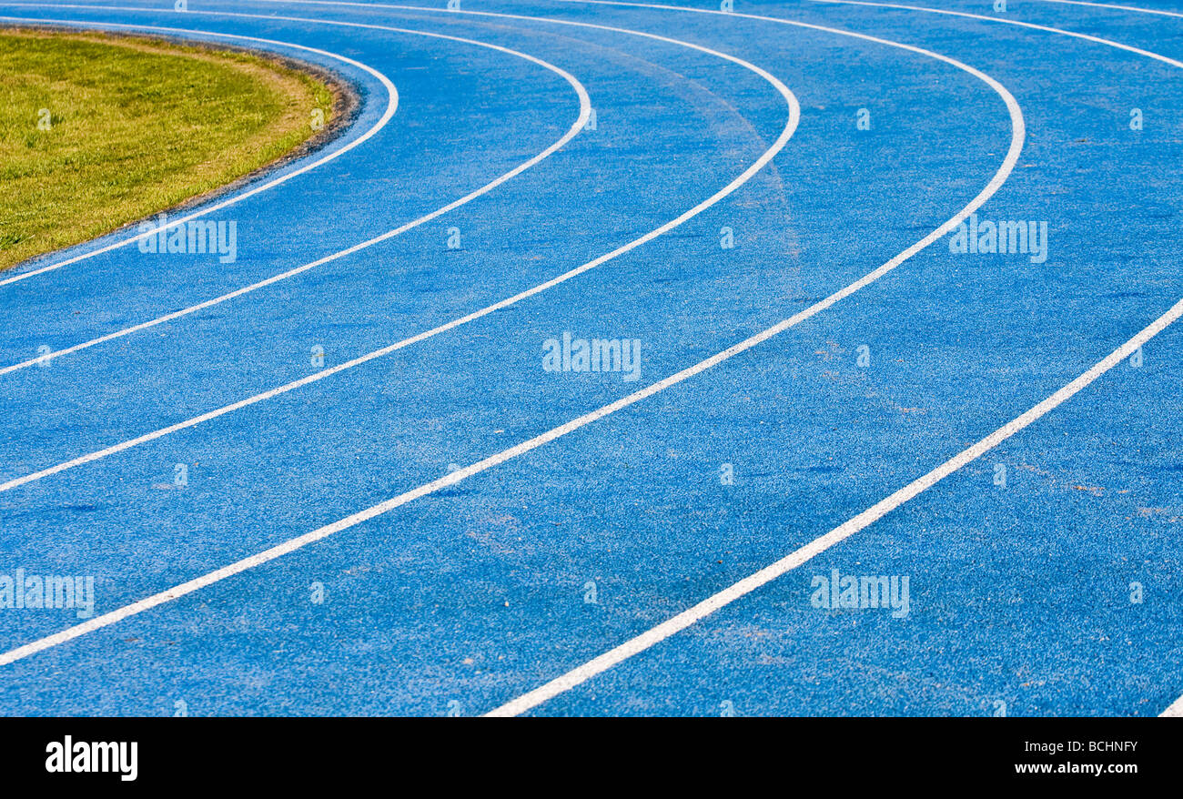 A blue track for running events showing lanes Stock Photo - Alamy