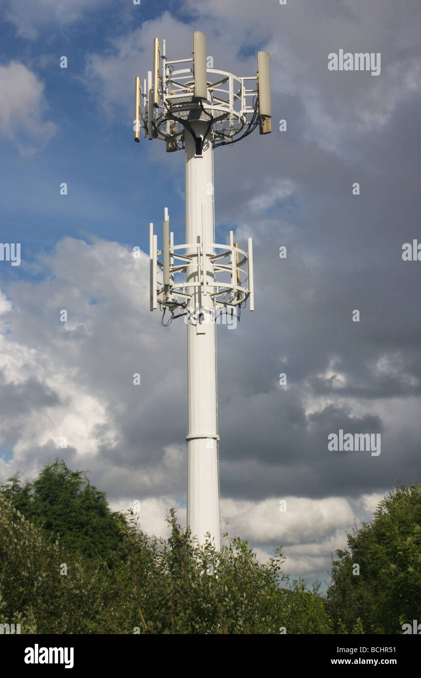 Storm clouds gather over mobile telephone mast Stock Photo - Alamy
