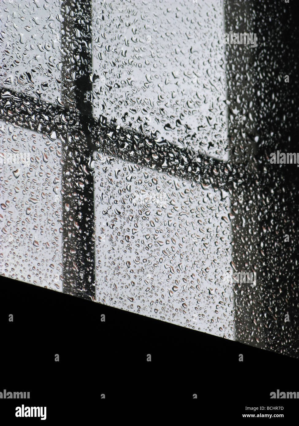 rain drops covered window seen from inside dark room Stock Photo - Alamy