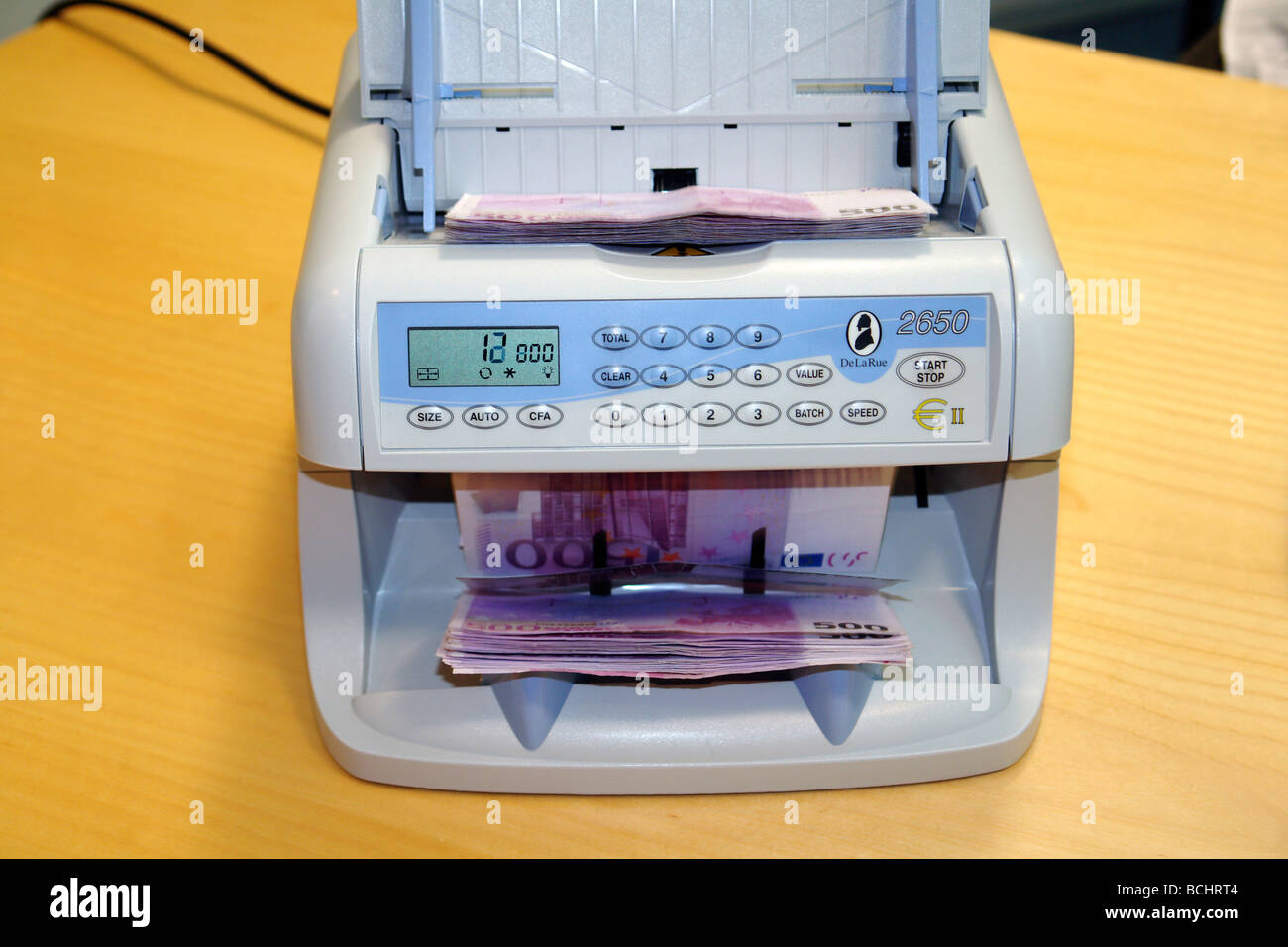 Automatic Money counting machine May 07 Stock Photo - Alamy