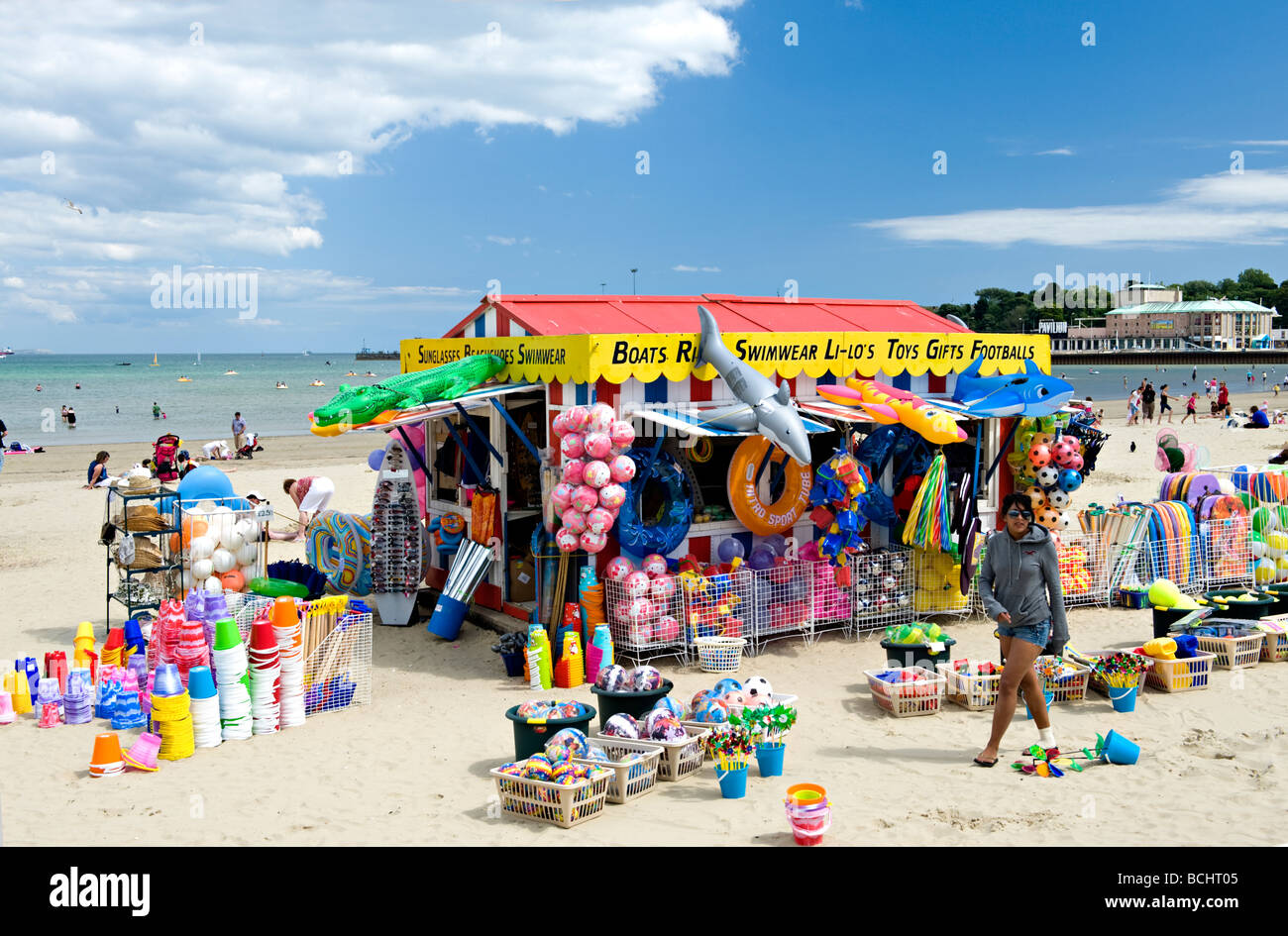 Colourful items for sale on a beach stall in Weymouth, Dorset, England ...